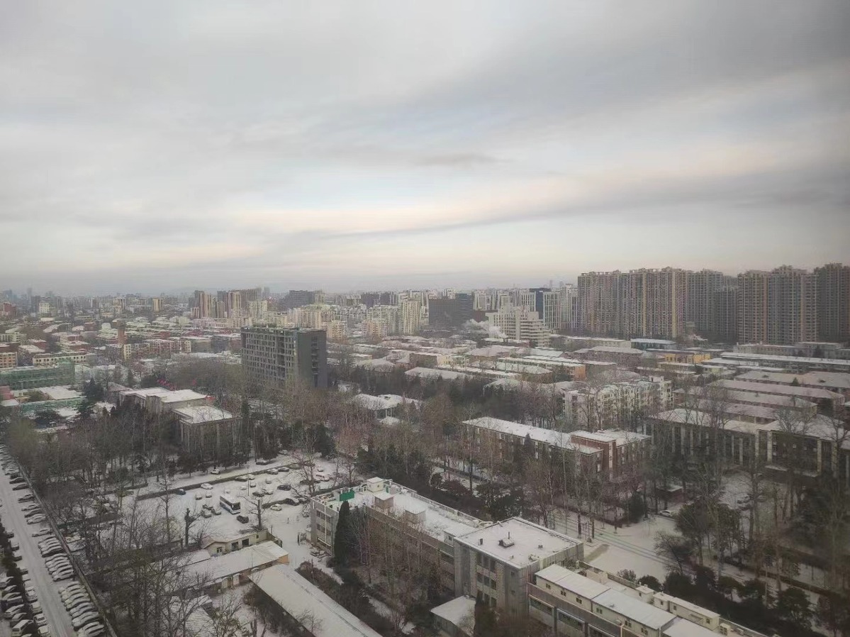 english news 英语新闻-Beijing embraces first snow in the Year of the Rabbit